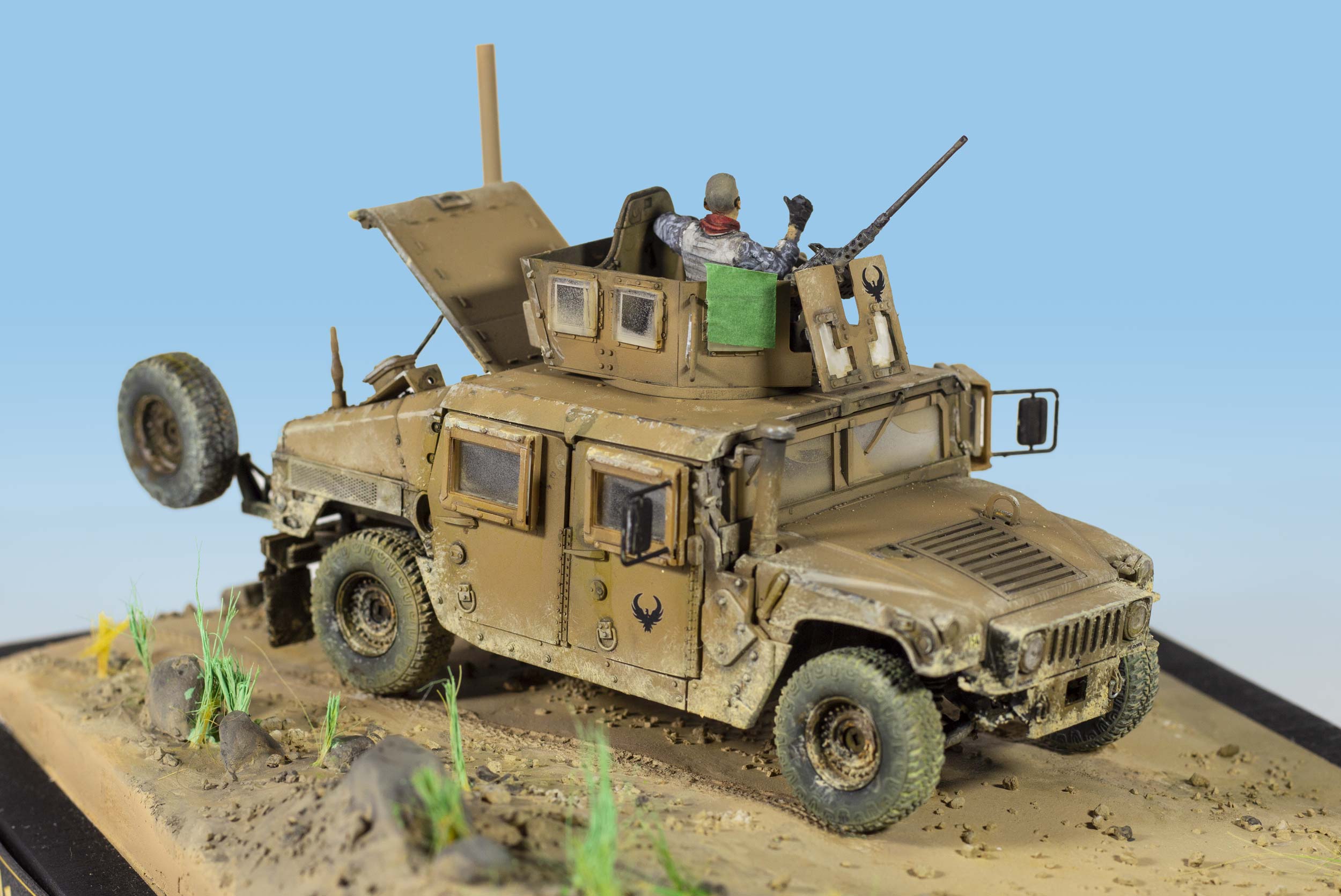 M1151 1/35" Enhanced Armament Carrier with a desert diorama.